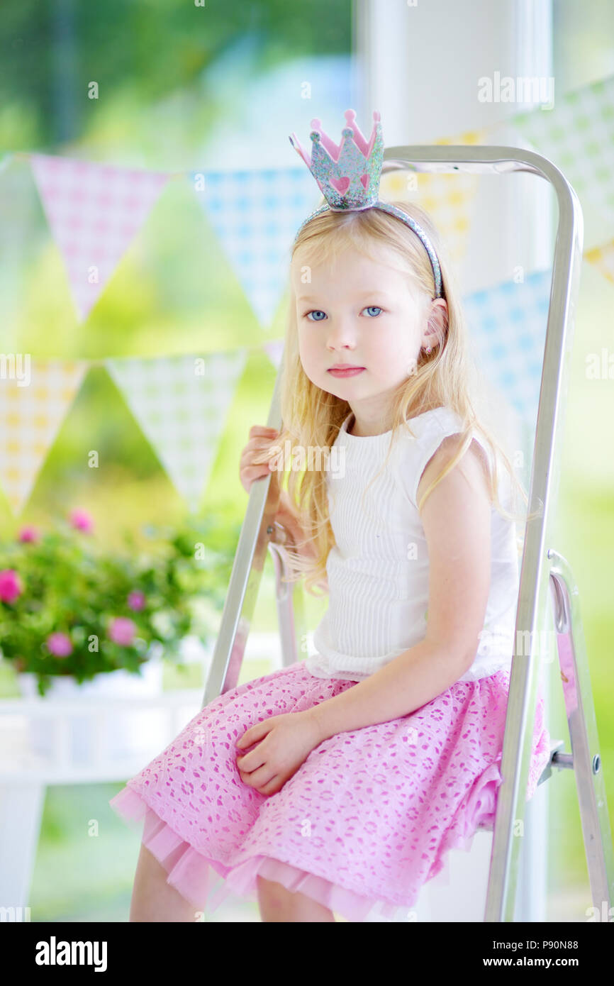 Portrait of adorable little girl wearing beautiful dress and a princess ...