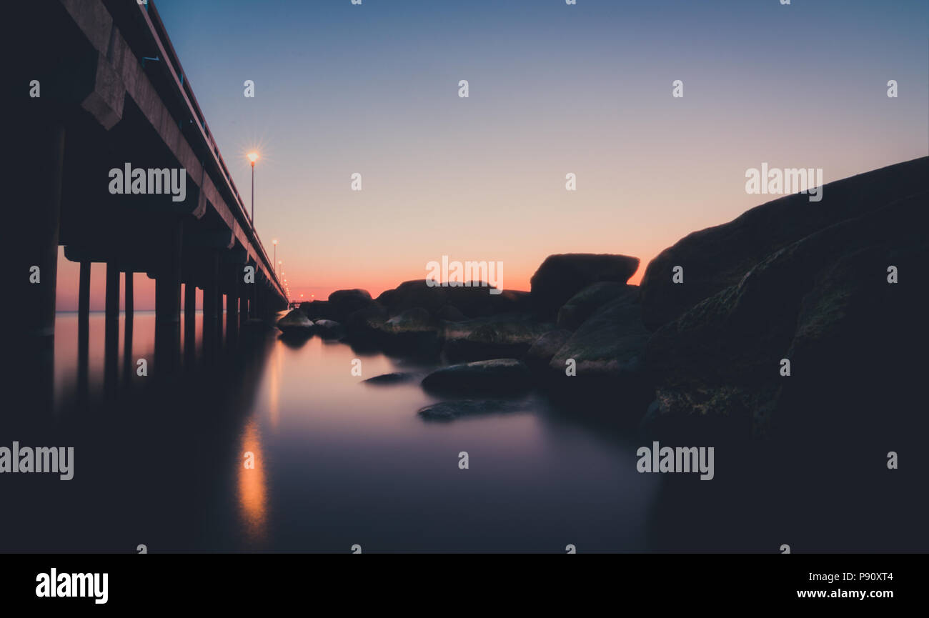 Palanga bridge and ruins of old bridge stones with silky sea Stock ...