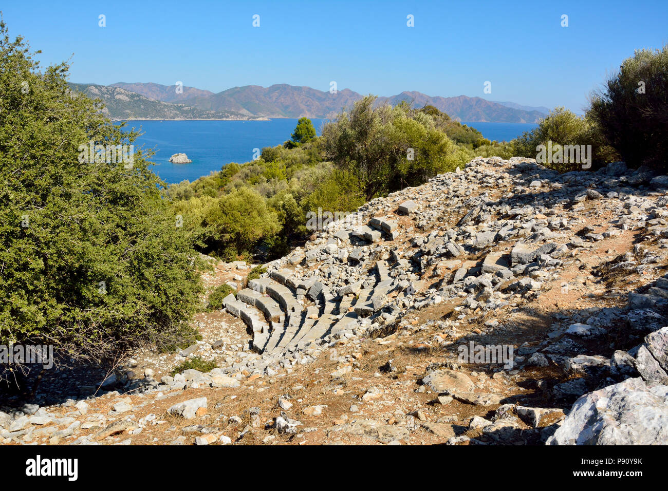 Ruins of amphitheatre in Amos ancient site on Bozburun peninsula near ...
