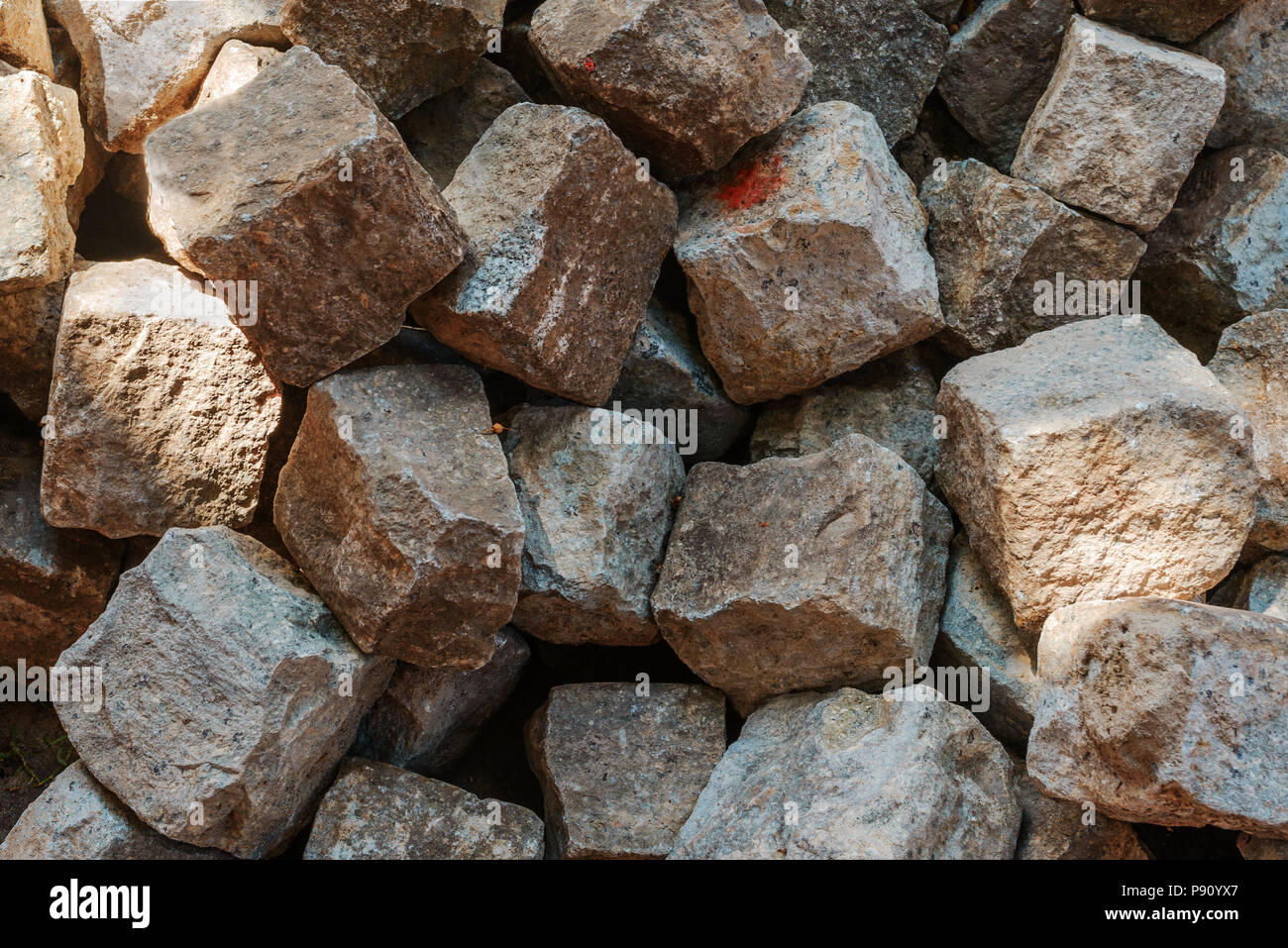 Pile of granite cobblestone cubes and blocks Stock Photo - Alamy