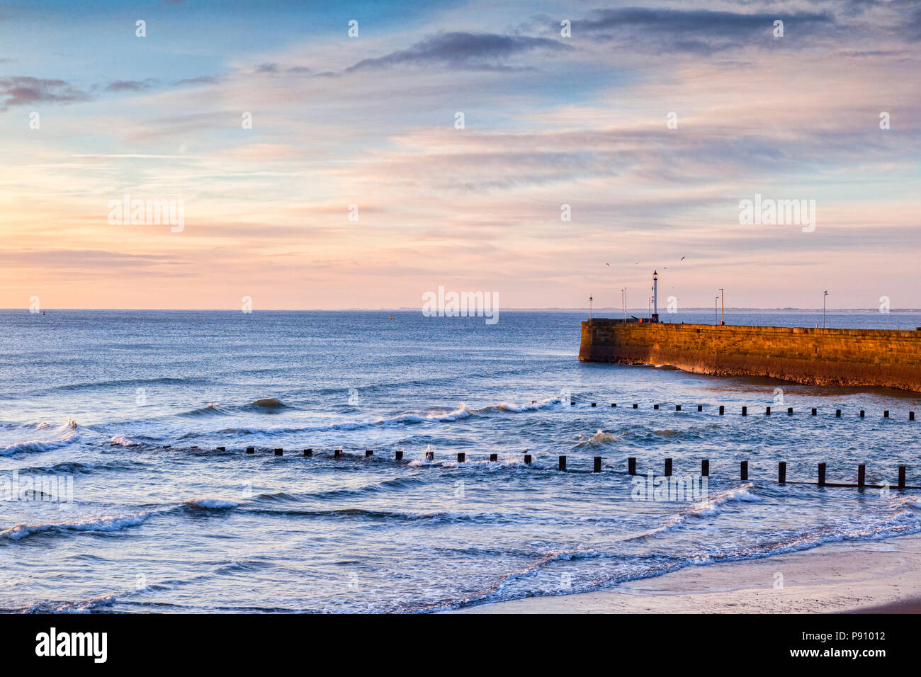 Bridlington Beach and harbour wall, East Riding of Yorkshire, England ...