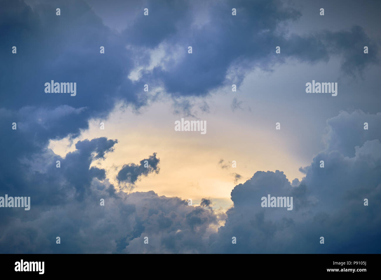 Dramatic evening clouds with a bright yellow sky Stock Photo - Alamy