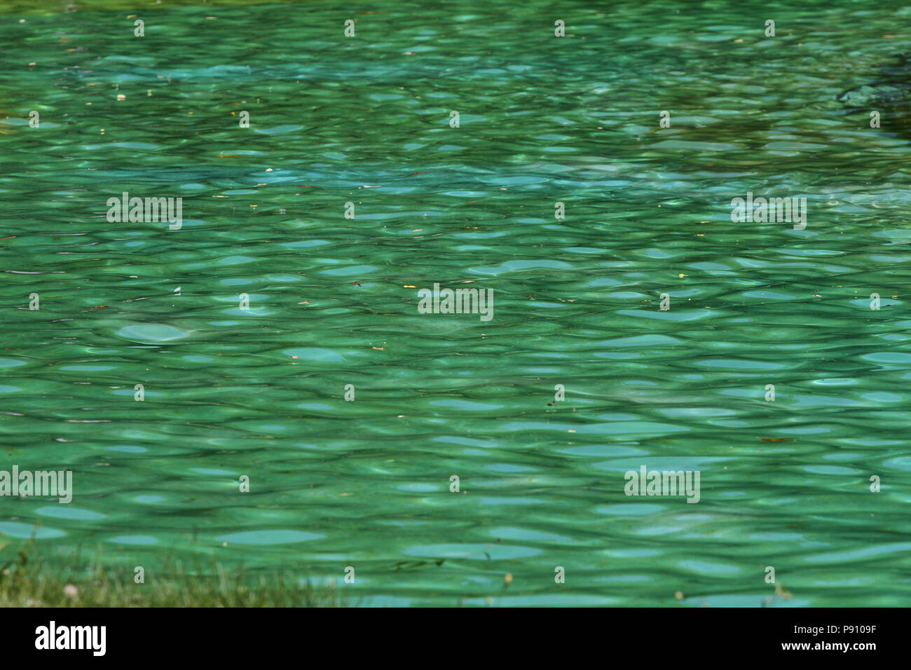 Water background. Surface of green Natural water. Aqua pattern. Rippled ...