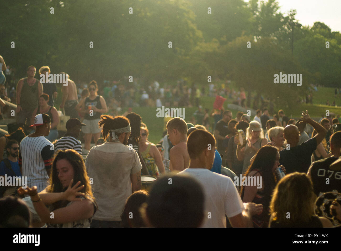 Happy crowd partying - Warm filter Stock Photo - Alamy