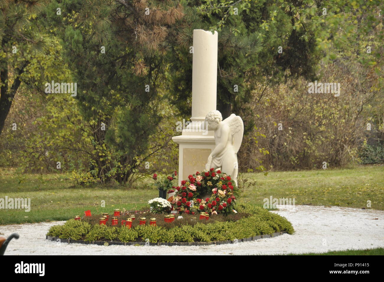 mozart's grave in the gothic cemetery in vienna with angel and flower ...