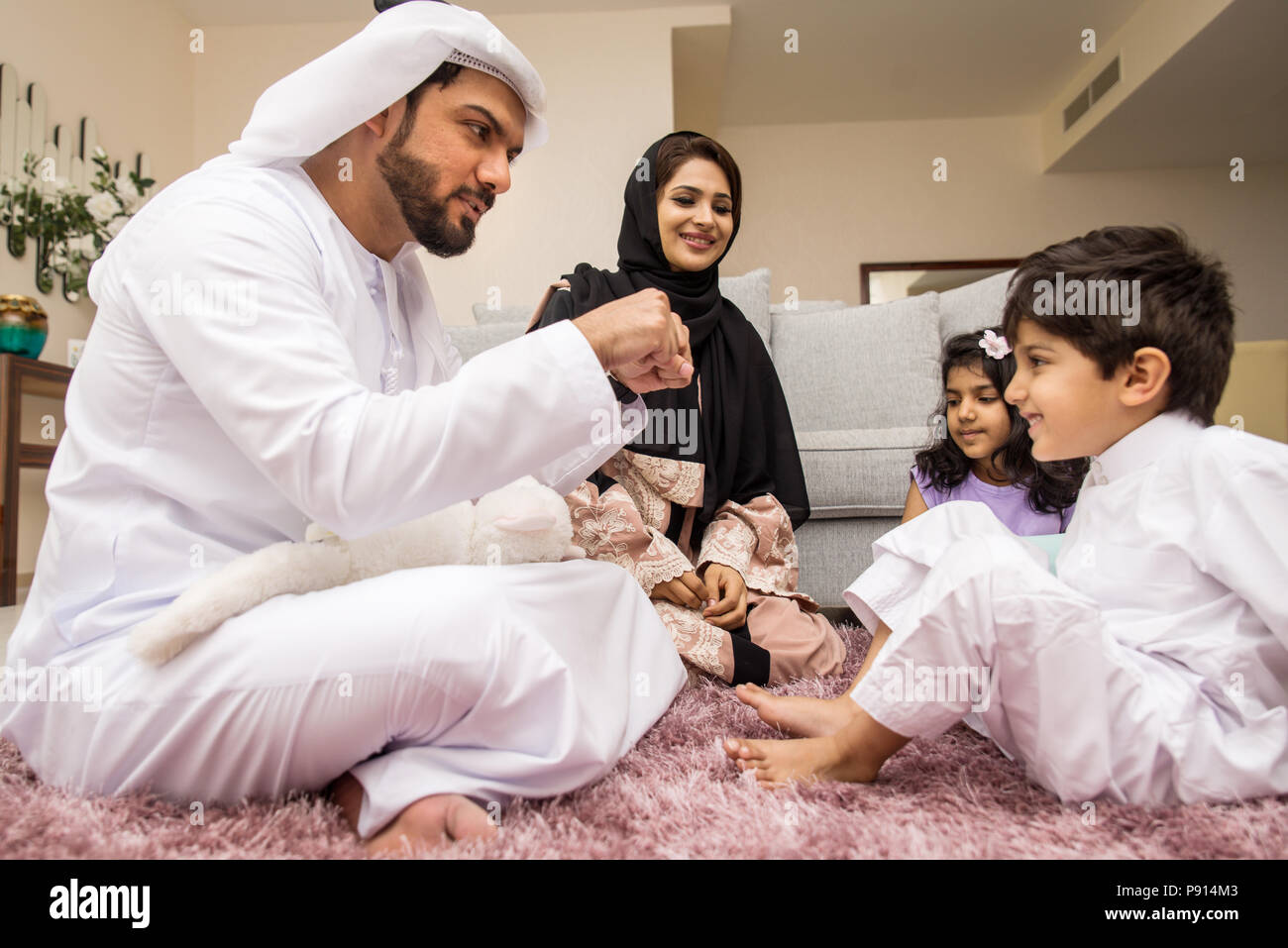Happy arabian family having fun at home Stock Photo - Alamy