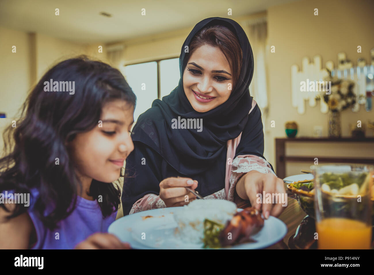 Happy arabian family having fun at home Stock Photo - Alamy
