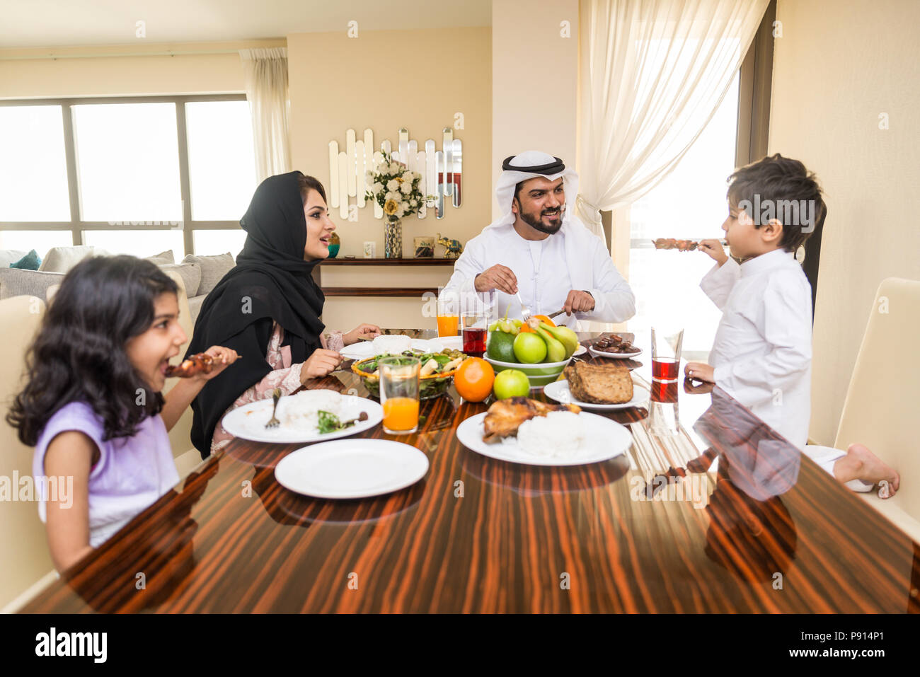 Happy arabian family having fun at home Stock Photo - Alamy