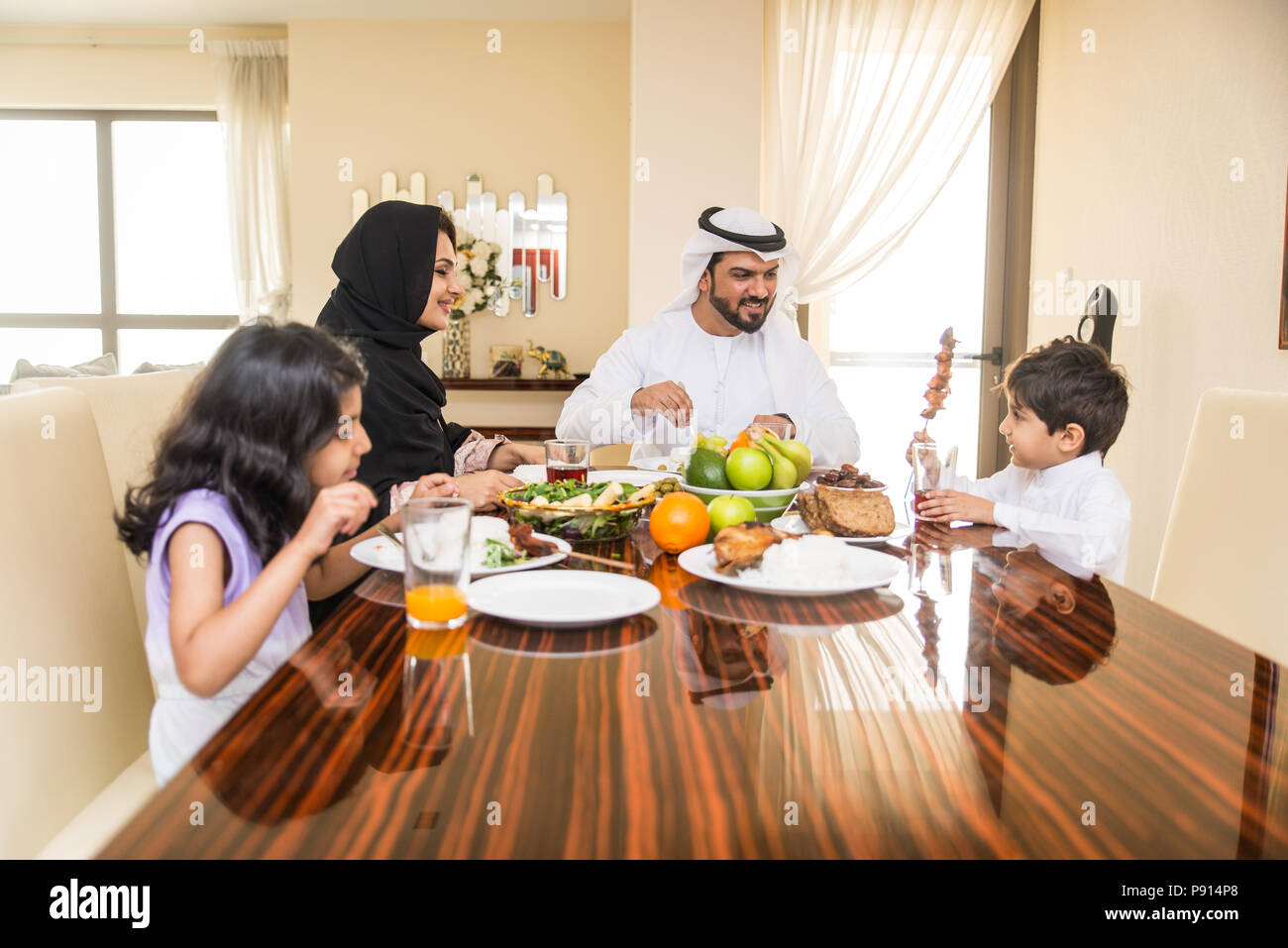 Happy arabian family having fun at home Stock Photo - Alamy