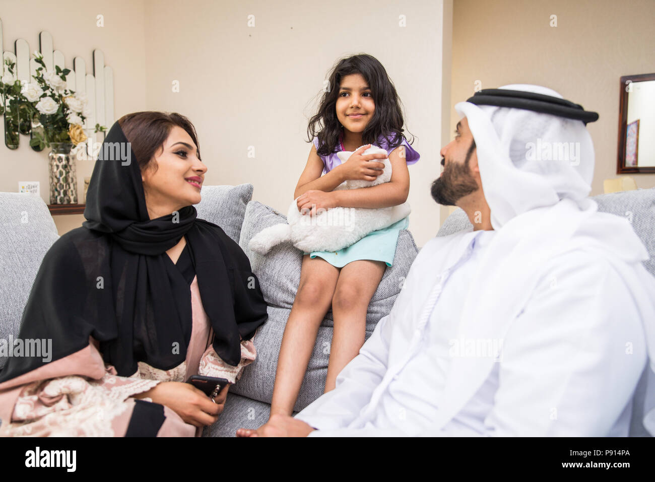 Happy arabian family having fun at home Stock Photo - Alamy