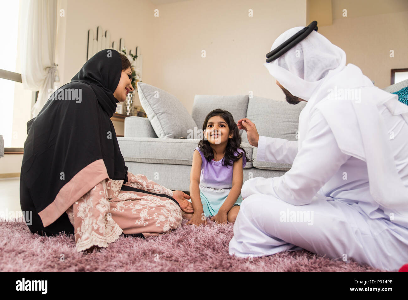 Happy arabian family having fun at home Stock Photo - Alamy