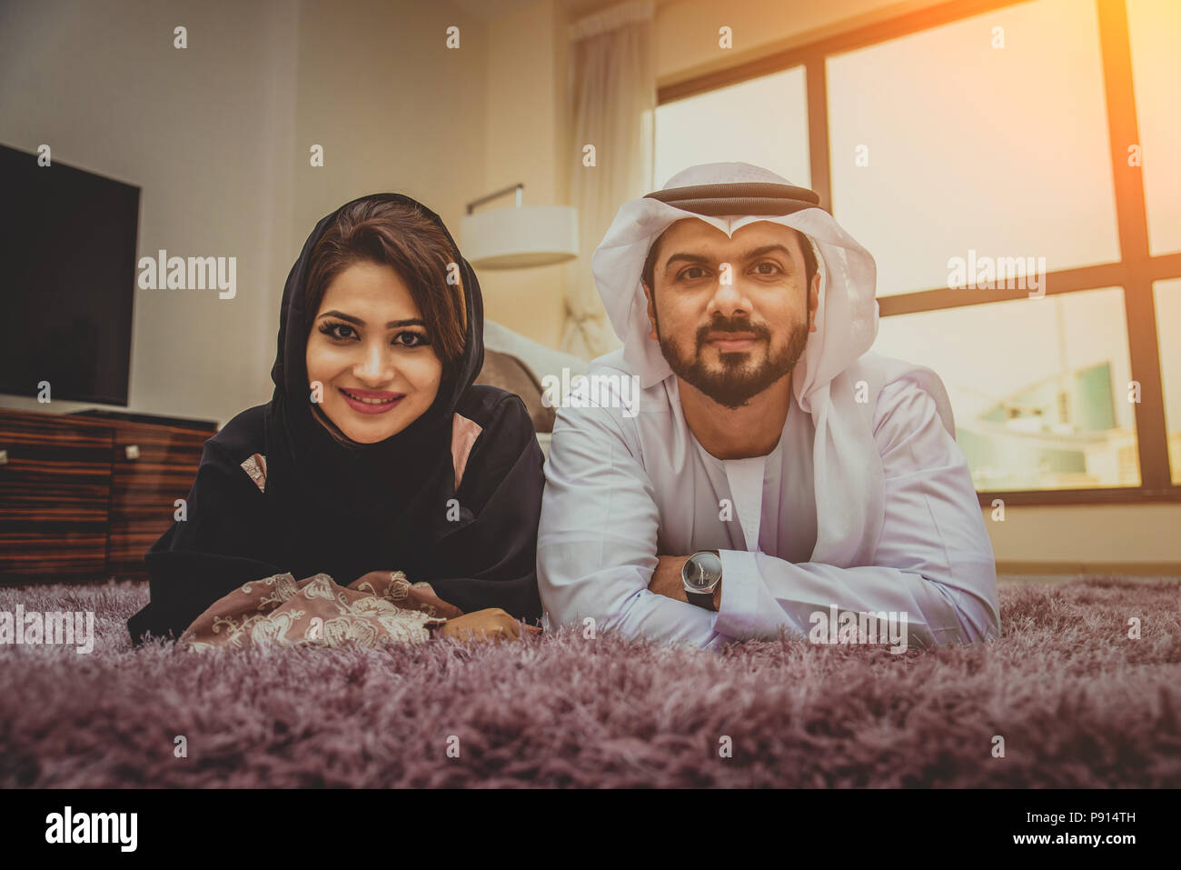 Happy arabic couple of lovers at home Stock Photo - Alamy