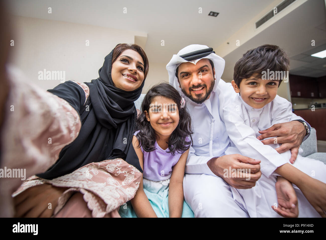 Happy arabian family having fun at home Stock Photo - Alamy