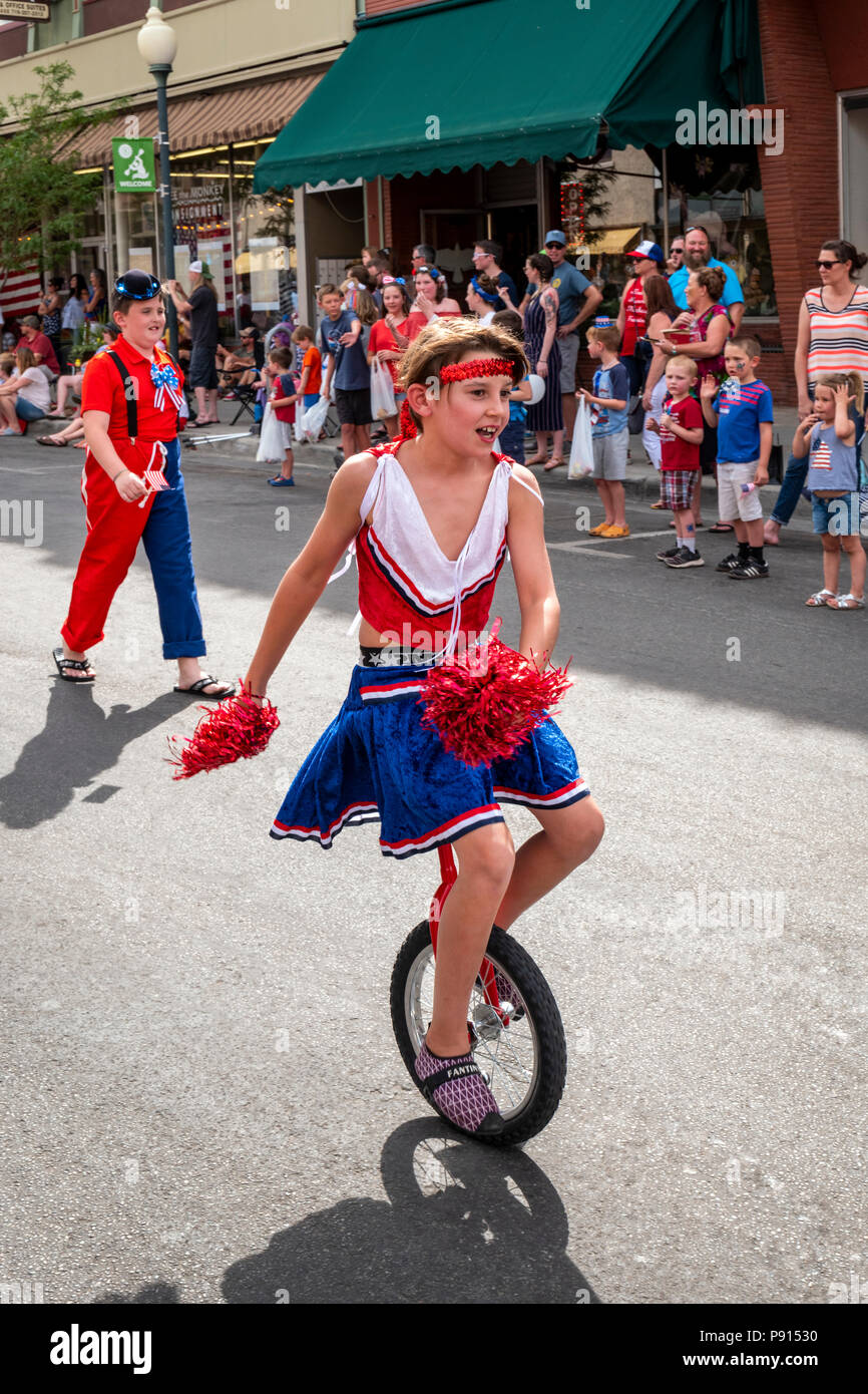 Salida Circus child riding unicycle in march in annual Fourth of July ...