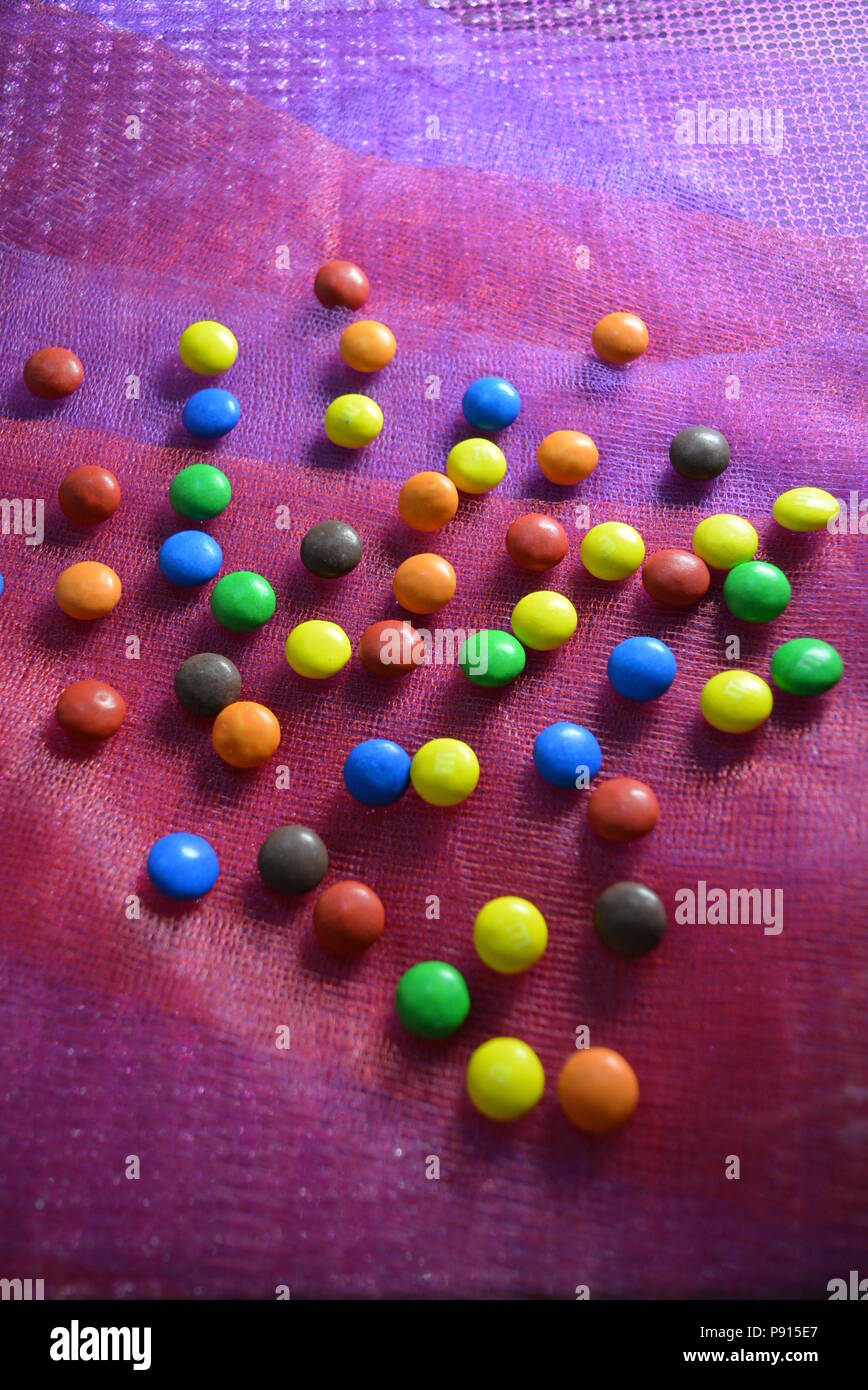Matte beautiful sweets, shivering candies of brown, blue, orange ...