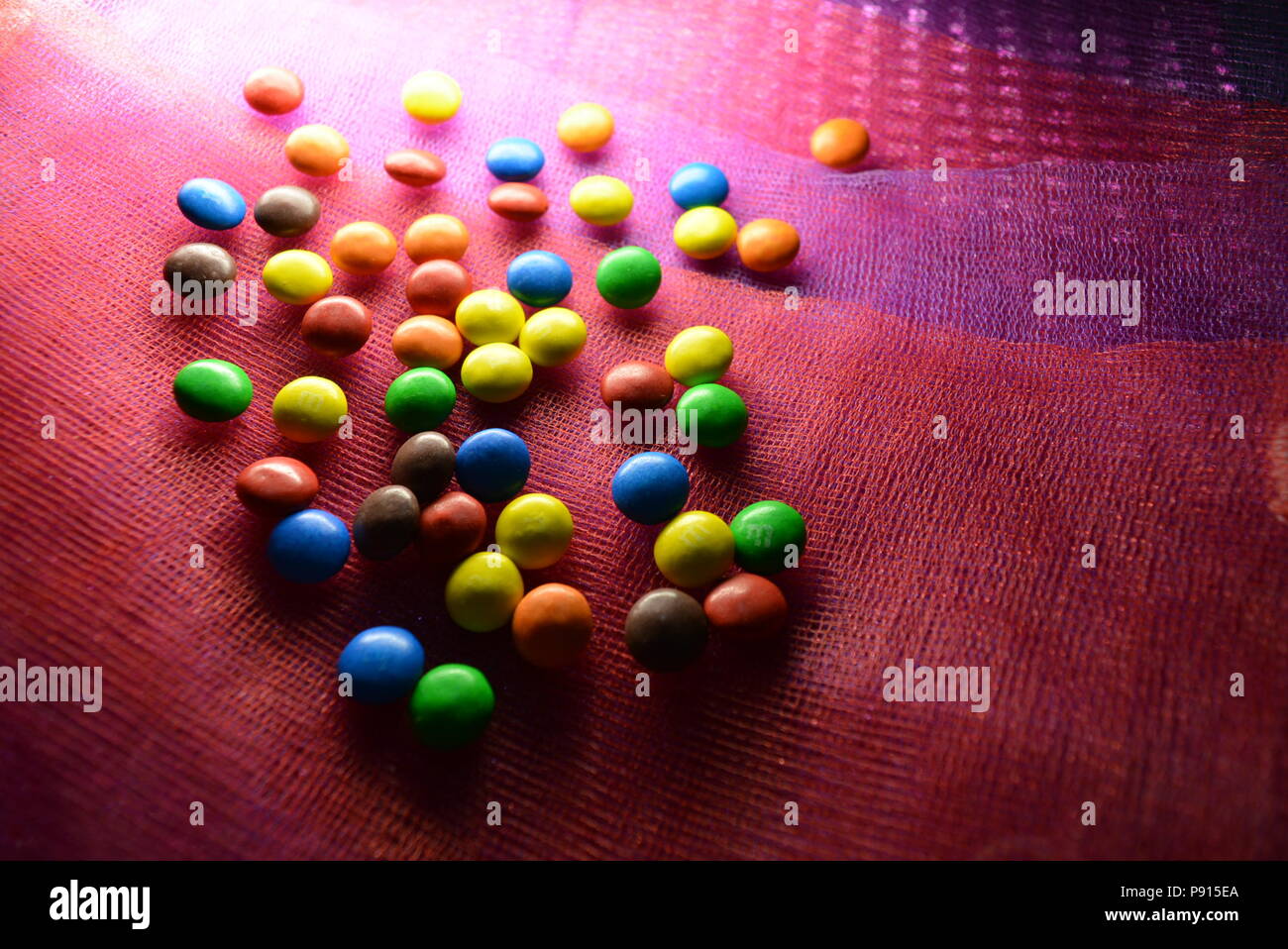 Matte beautiful sweets, shivering candies of brown, blue, orange ...