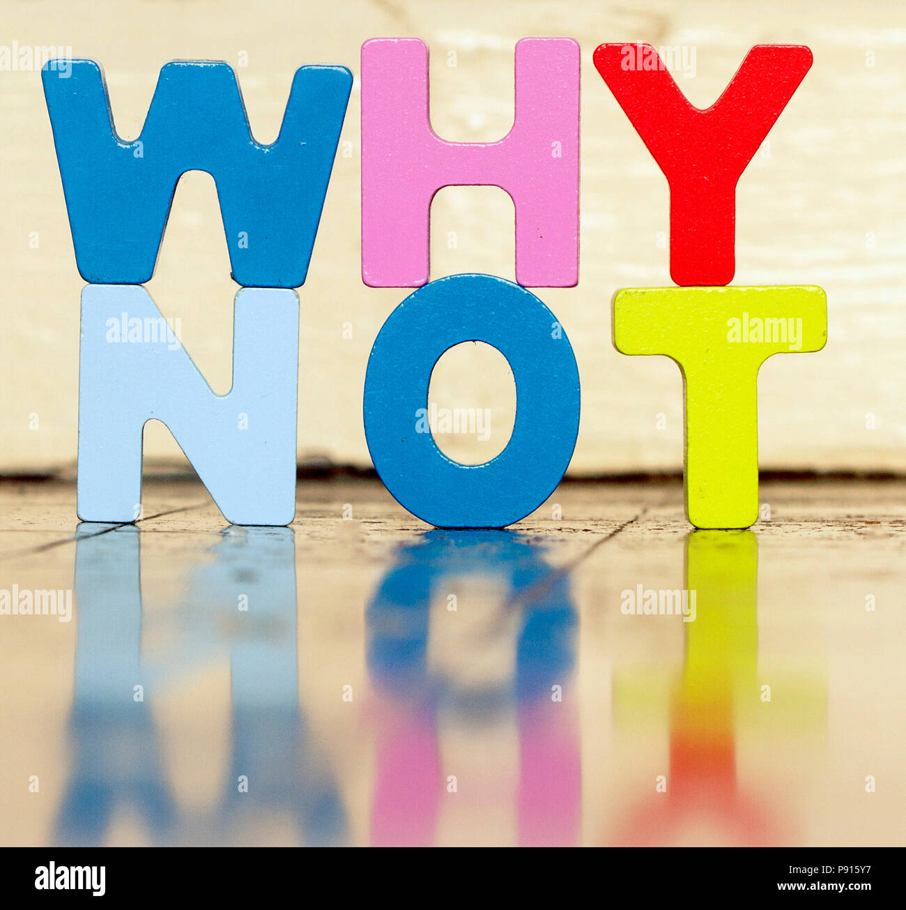 the words WHY NOT with wooden letters on a wooden floor with bright ...