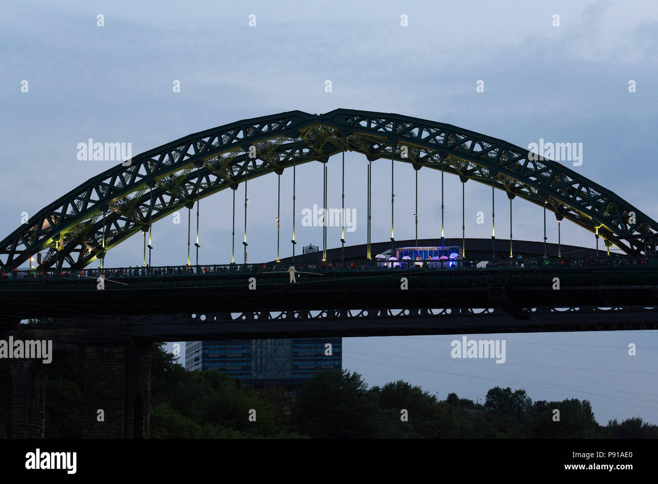 Members of Cirque Bijou perform a high wire act to Wearmouth Bridge in ...