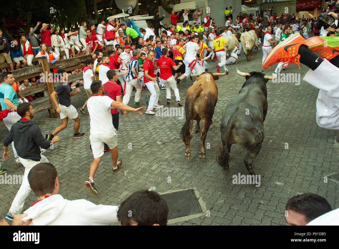 Pamplona, Spain, 13 July 2018. Participants run ahead of Miura s ...