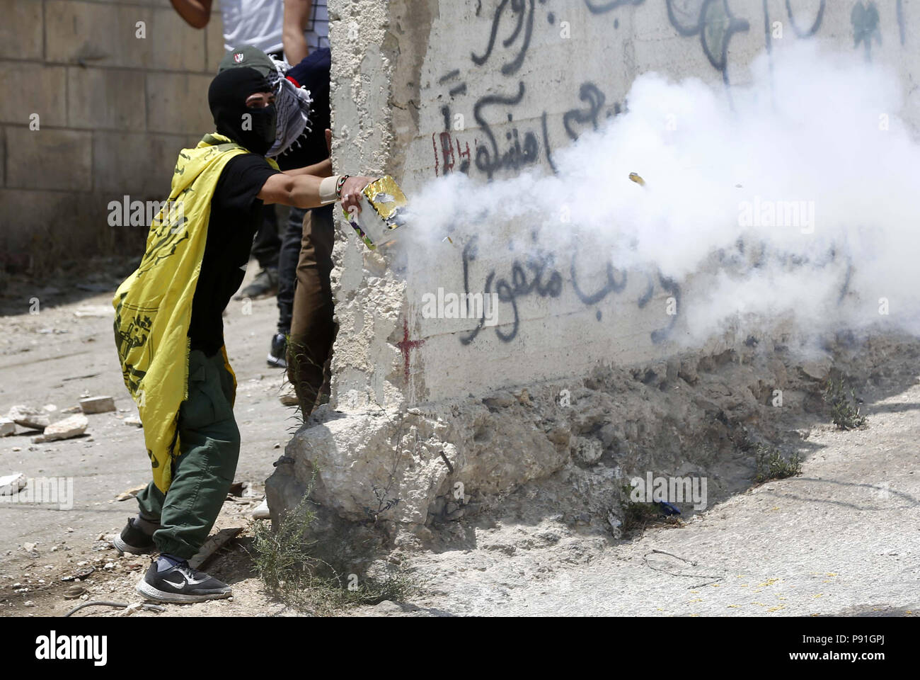Palestinian protester releases fireworks hi-res stock photography and ...