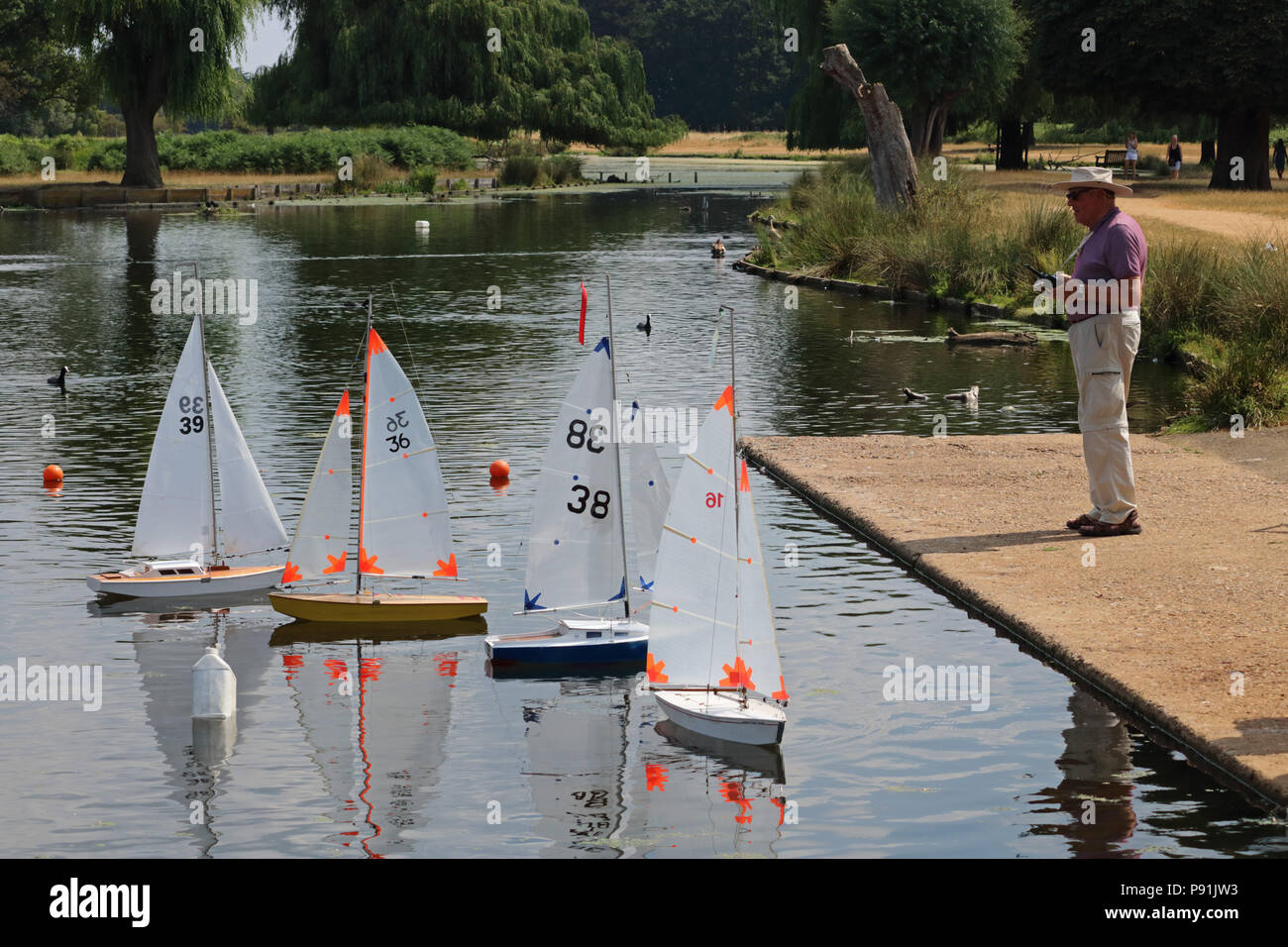 Bushy Park London England UK. 14th July 2018. Members of the model boat ...