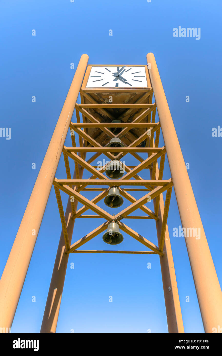 Clock tower with decorative bells below Stock Photo - Alamy