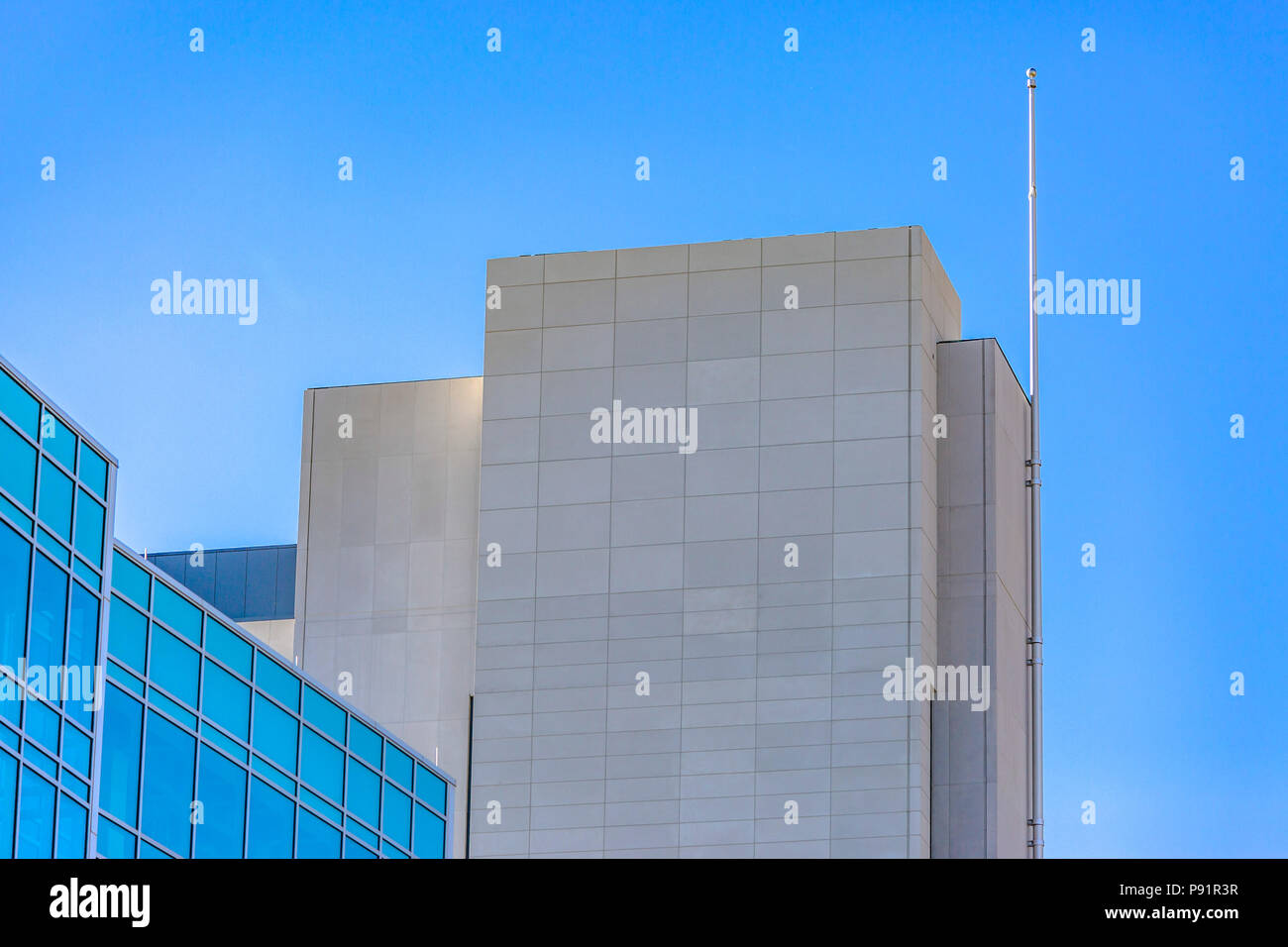 Concrete and glass contrast of two buildings Stock Photo - Alamy