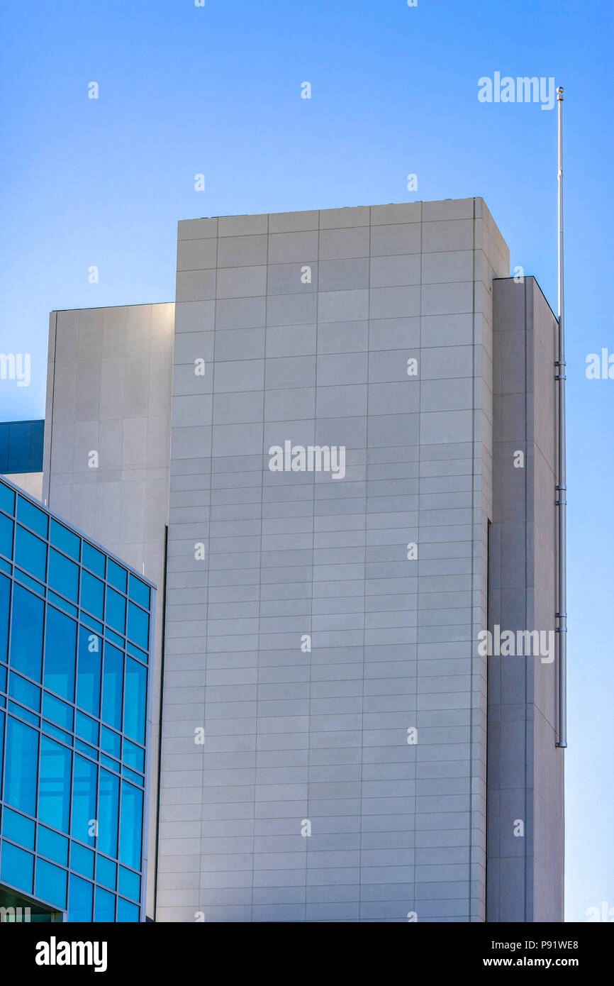 Glass and concrete contrast of two buildings Stock Photo - Alamy