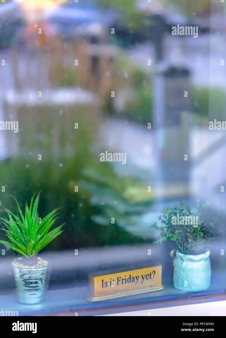 Is it friday yet sign in window of exterior Stock Photo - Alamy