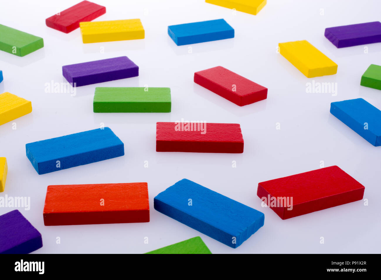 Color dominoes on a white background Stock Photo - Alamy