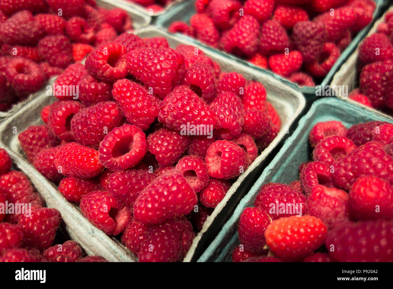 Fresh red raspberry fruits close up background Stock Photo - Alamy