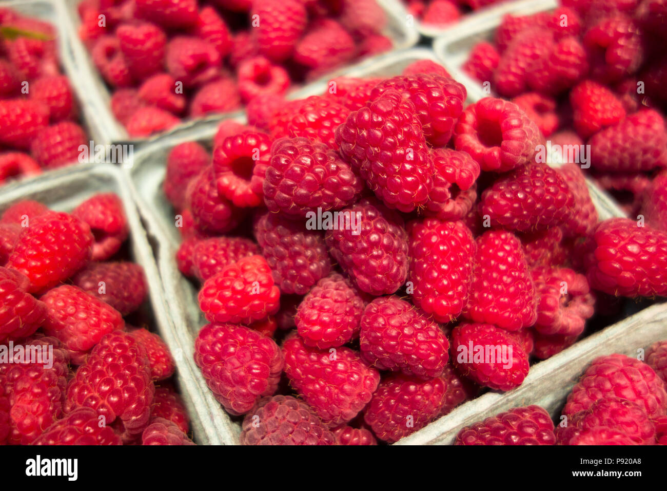 Fresh red raspberry fruits close up background Stock Photo - Alamy