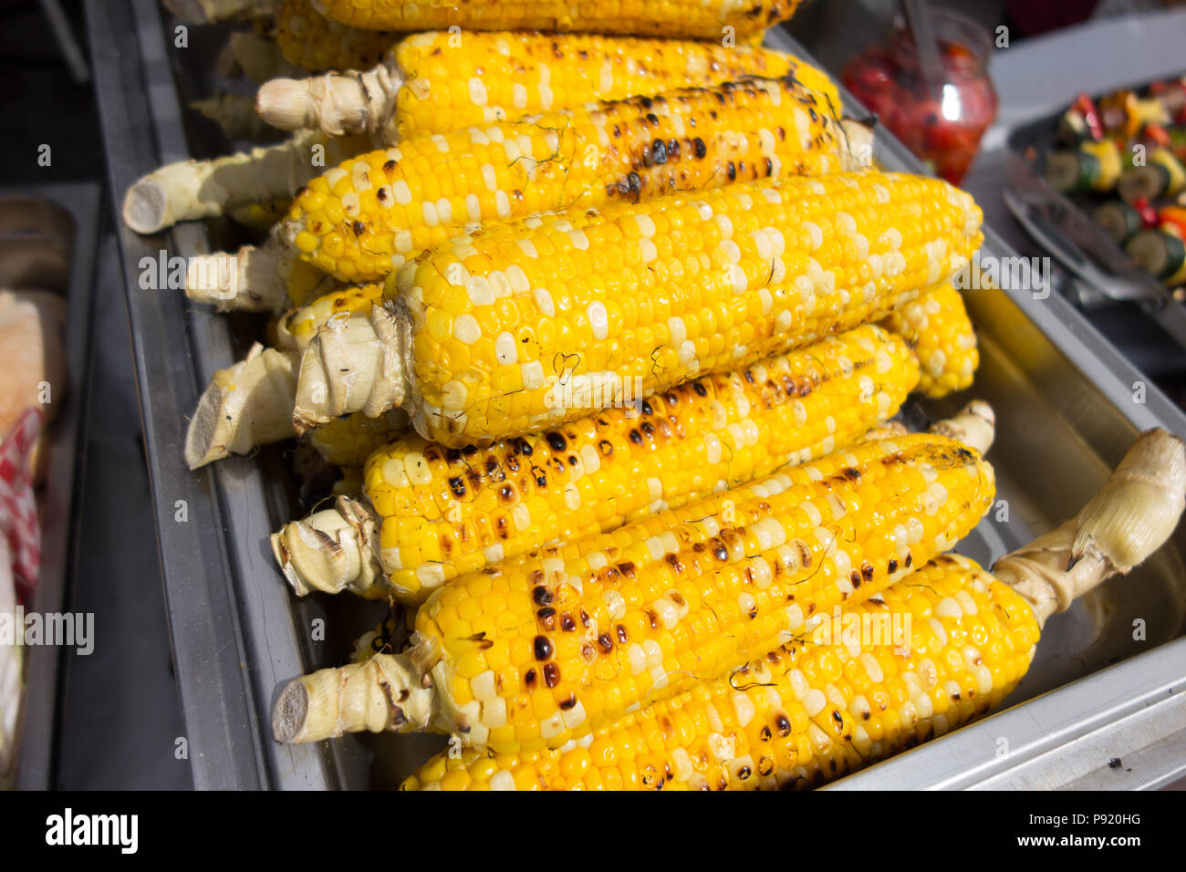 Roasted barbecue corn close up background Stock Photo - Alamy