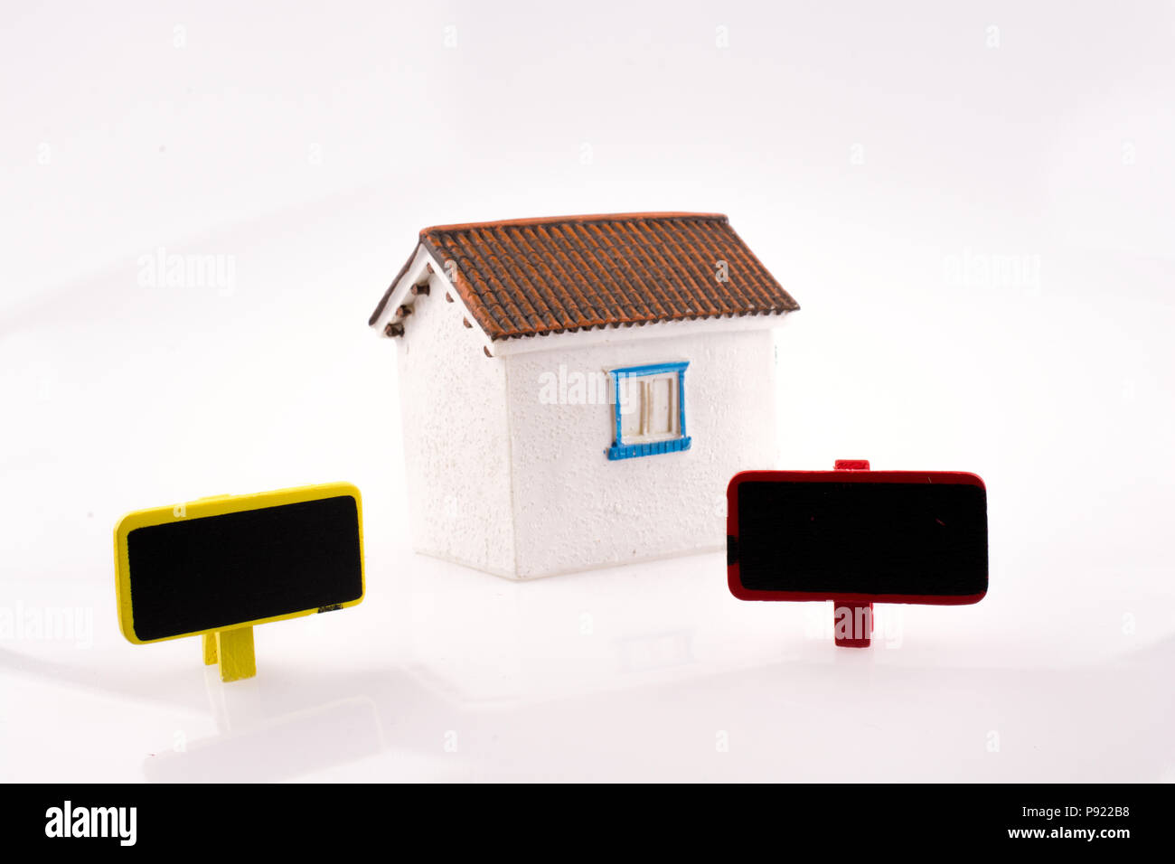 House and sign board on a white background Stock Photo - Alamy