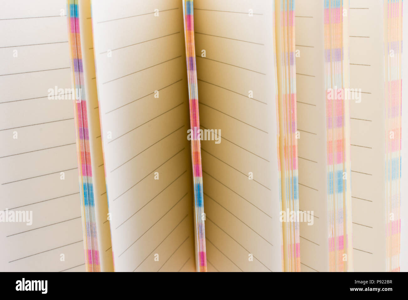Pink notebook on a white background Stock Photo - Alamy