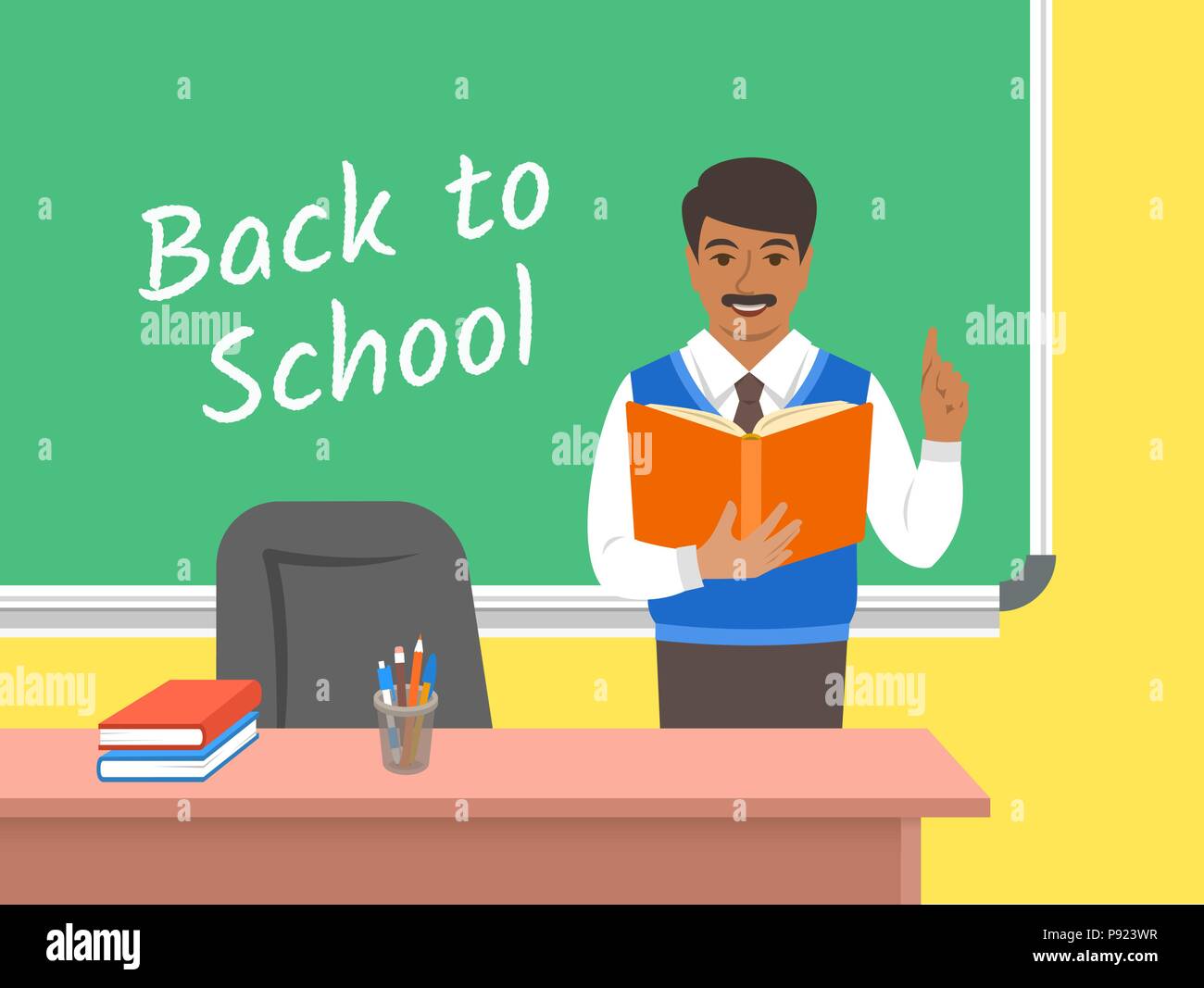 Teacher Indian man standing with open book at the blackboard in ...