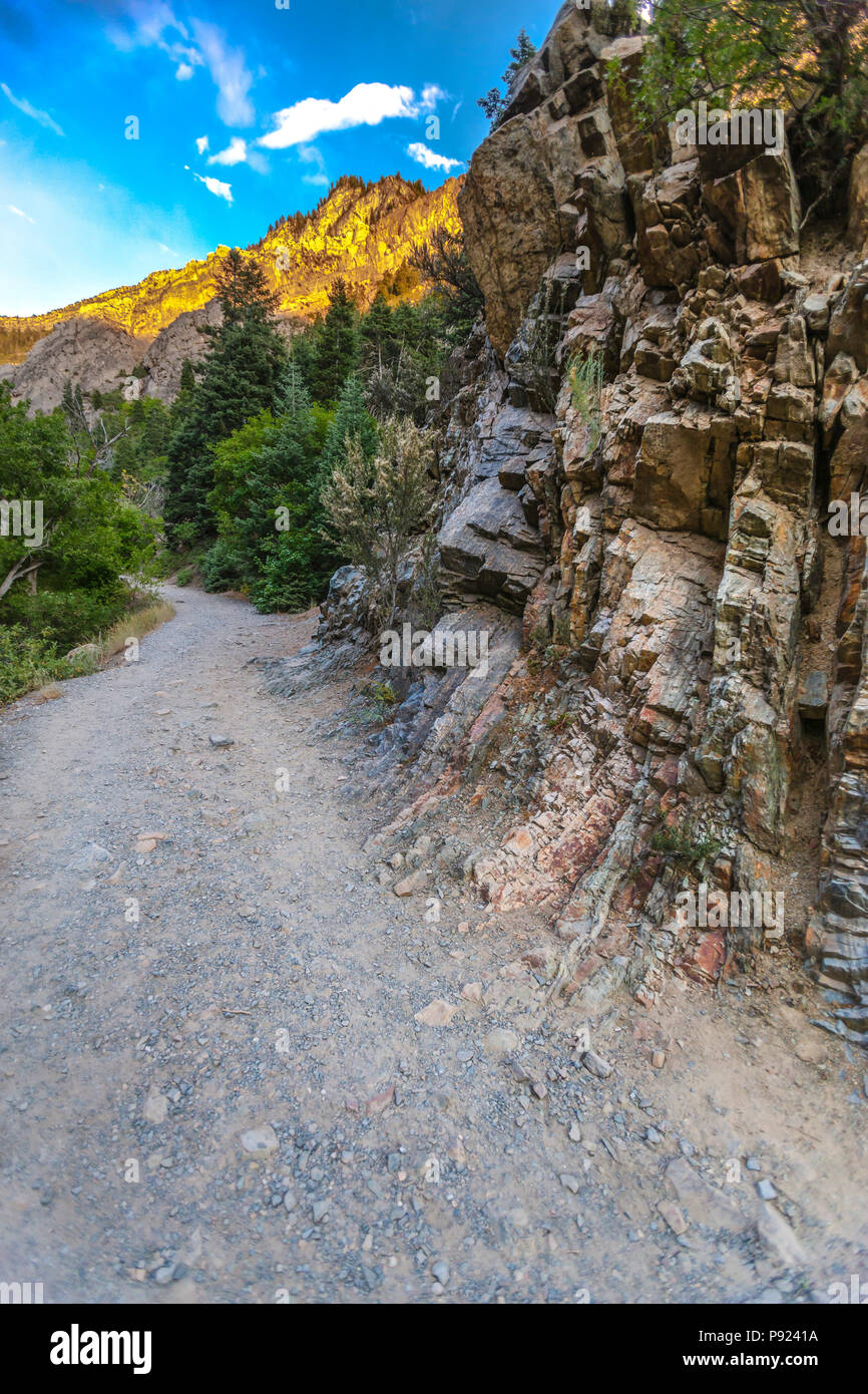 Rock wall and mountains in the background Stock Photo - Alamy
