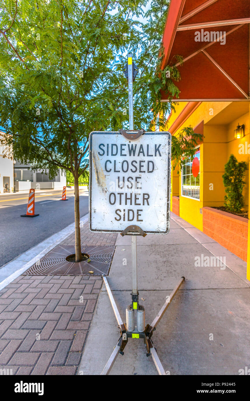 Sidewalk closed use other side sign Stock Photo - Alamy