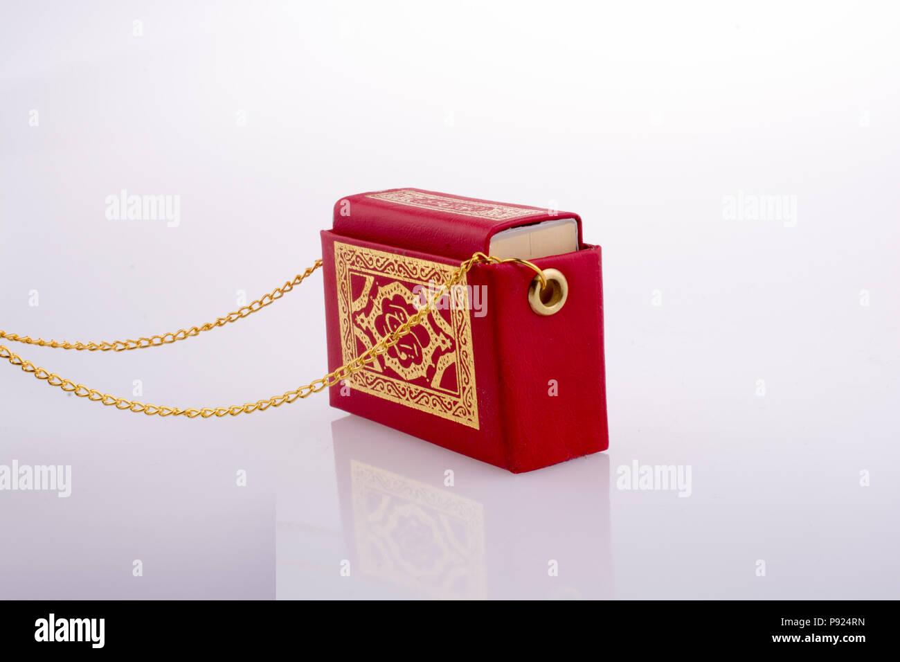 The Holy Quran on a white background Stock Photo - Alamy
