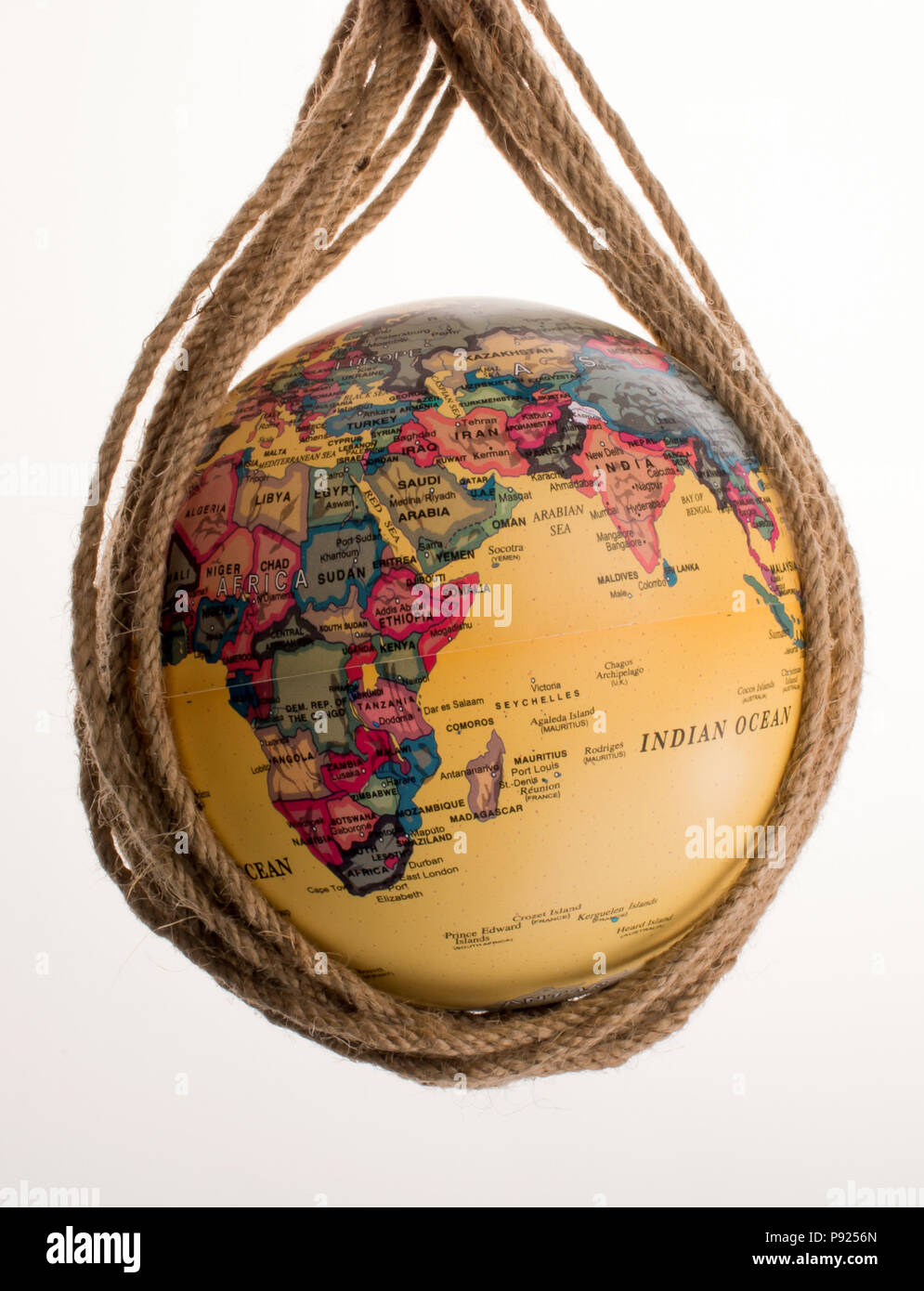globe hanging in rope on white background Stock Photo - Alamy