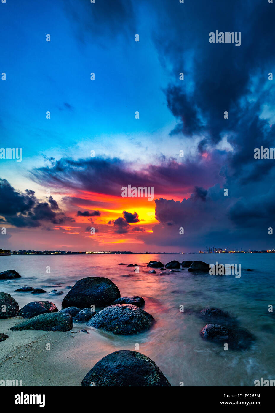 Rocks At Beach Against Sky During Sunset Stock Photo - Alamy