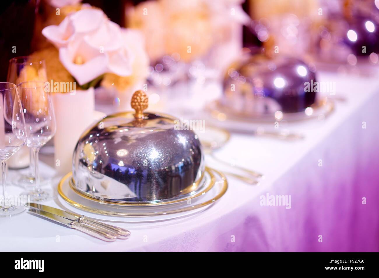 Beautiful table setting with crockery and flowers for a party, wedding ...