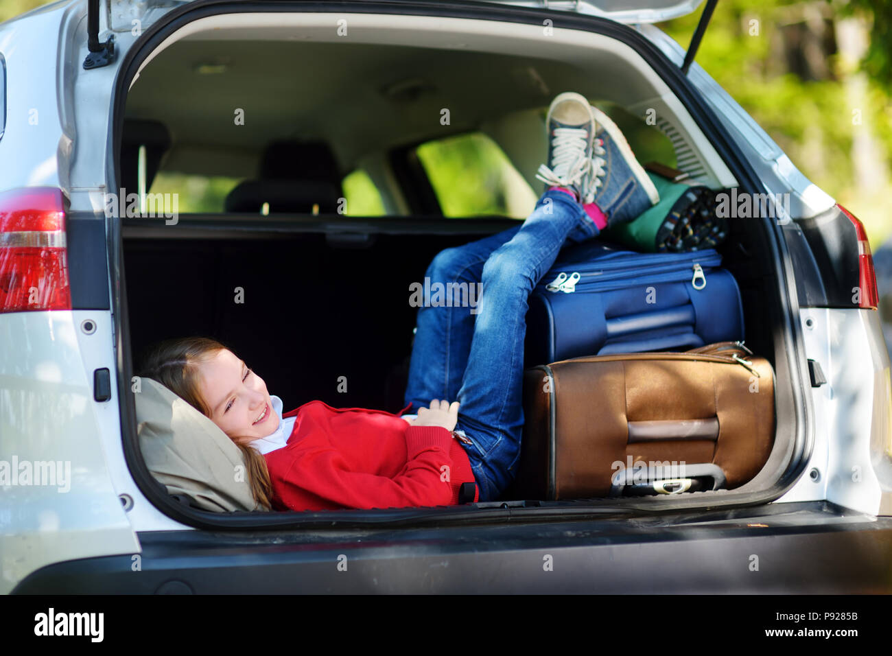 Adorable little girl ready to go on vacations with her parents. Kid ...