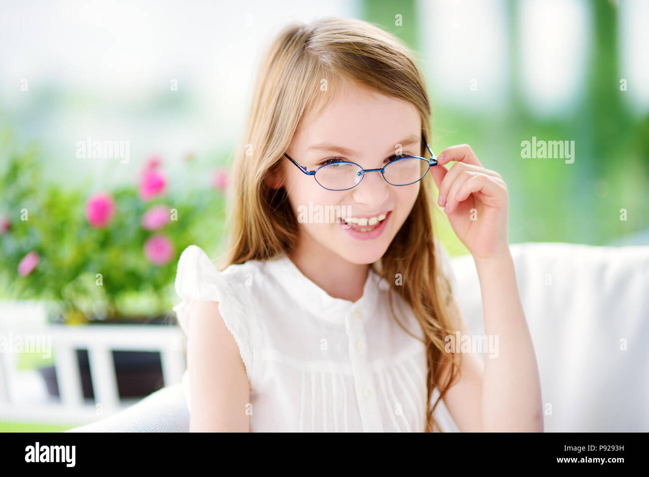 Portrait of beautiful little girl wearing glasses at home. Vision ...