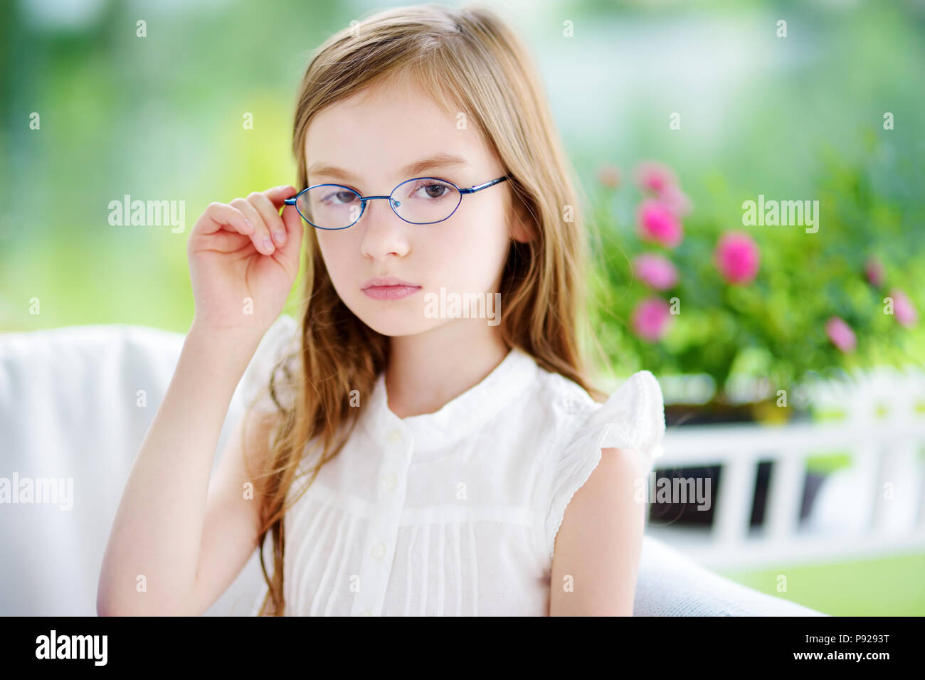 Portrait of beautiful little girl wearing glasses at home. Vision ...