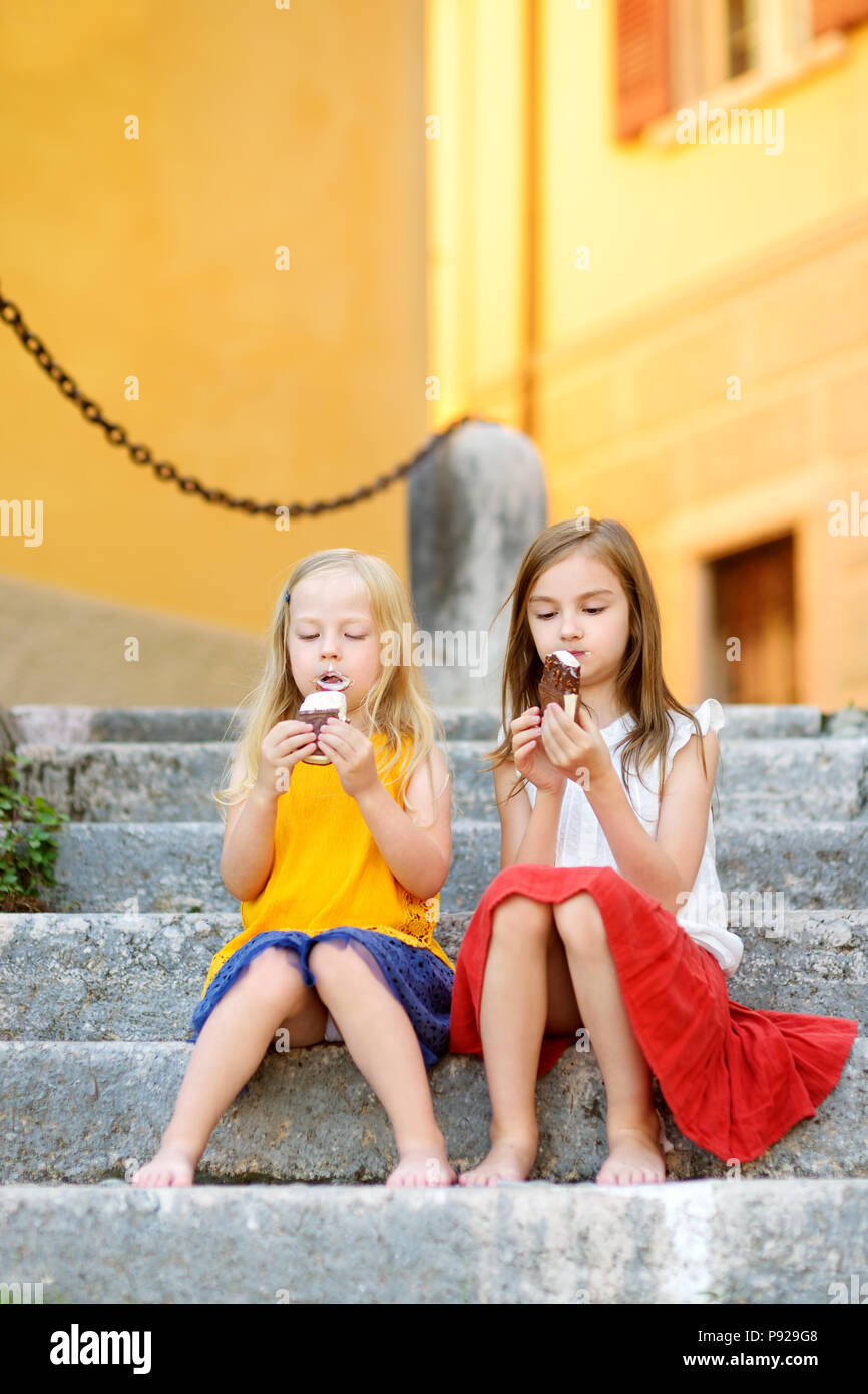 Two sisters sitting on stairs hi-res stock photography and images - Alamy