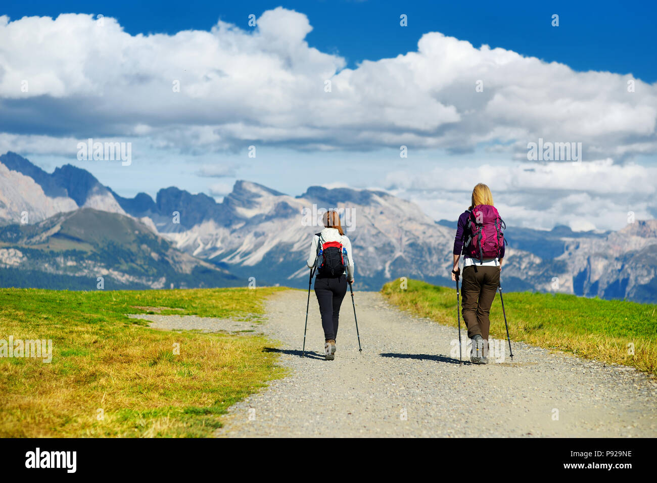 Tourists hiking in Seiser Alm, the largest high altitude Alpine meadow ...