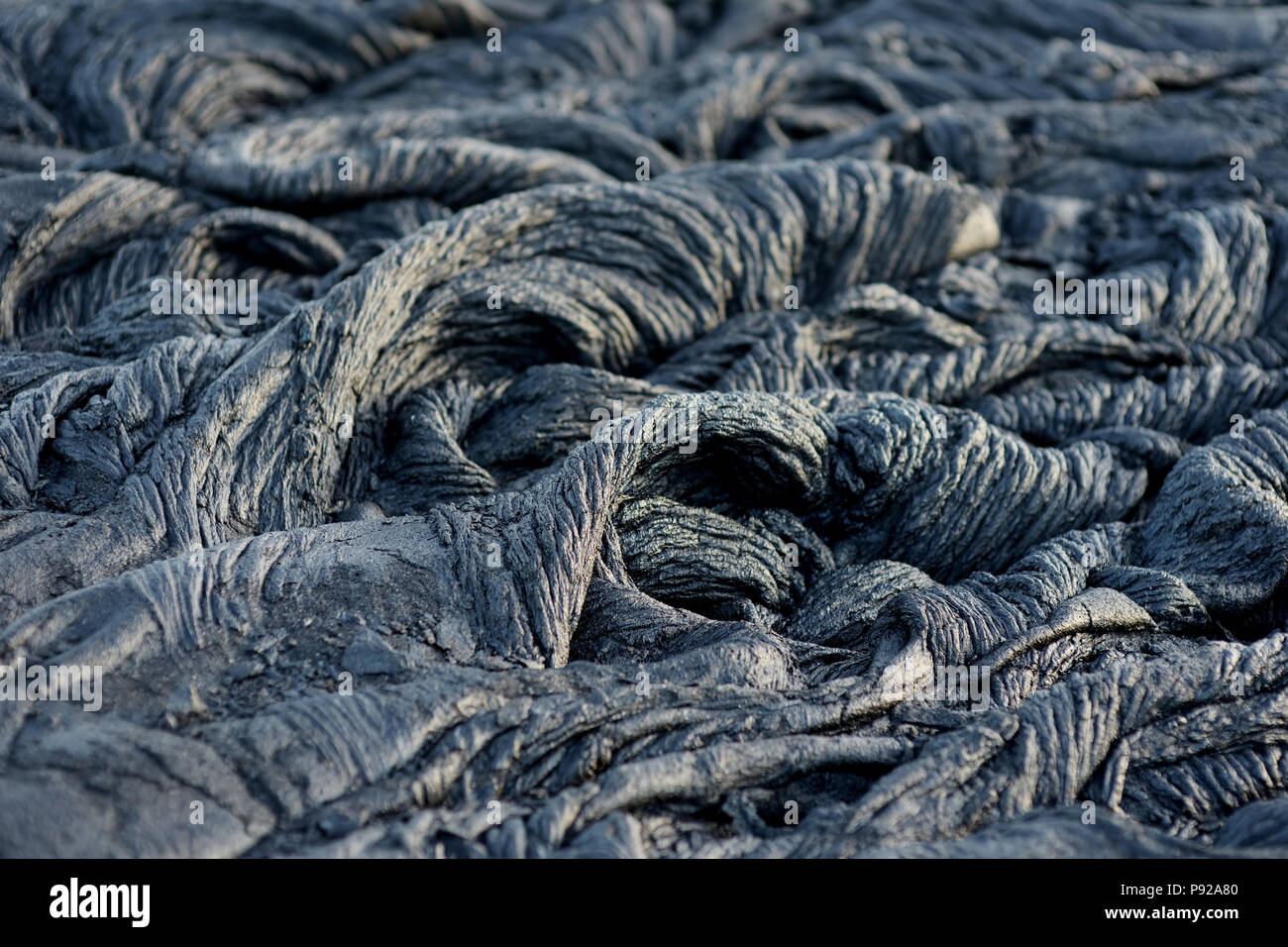Smooth, undulating surface of frozen pahoehoe lava. Frozen lava ...
