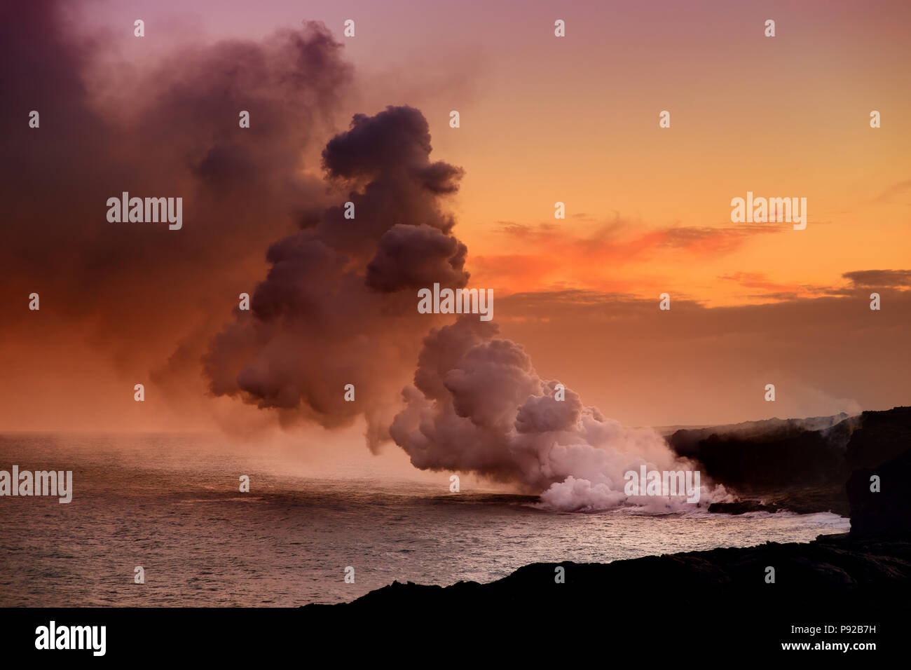 Lava pouring into the ocean creating a huge poisonous plume of smoke at ...