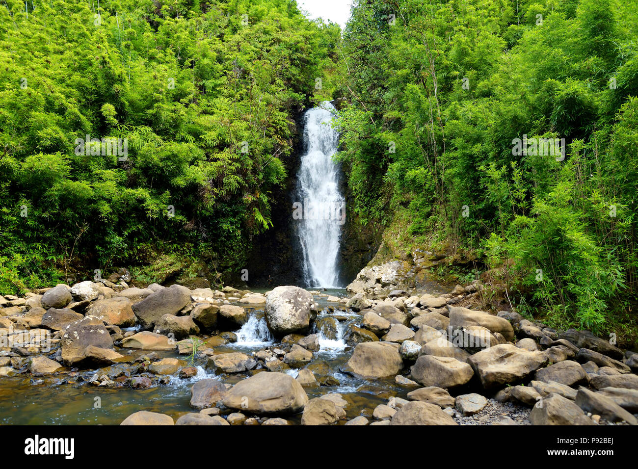 Beautiful view of a waterfall located along famous Road to Hana on Maui ...